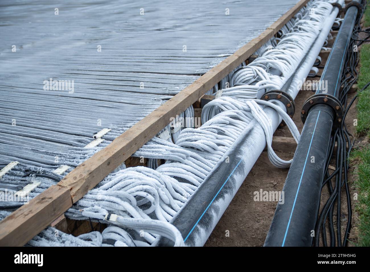 Pouring with frozen water of plastic conduit and elastic pipeline of ...