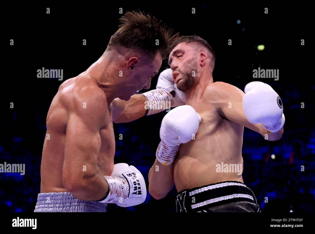 Paddy Donovan (left) and Danny Ball in action during their WBA ...