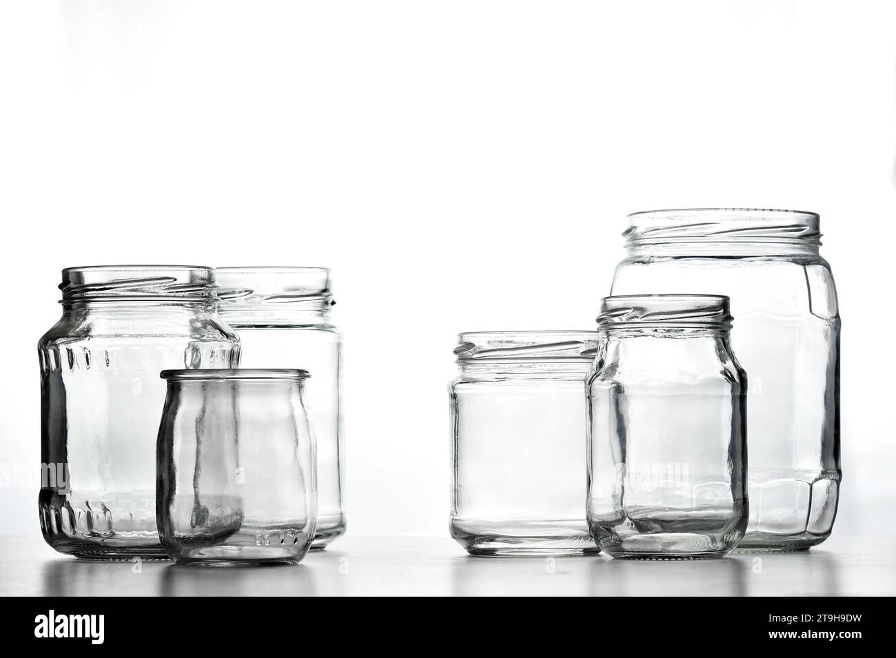 Glass jars open without lids collection Stock Photo - Alamy