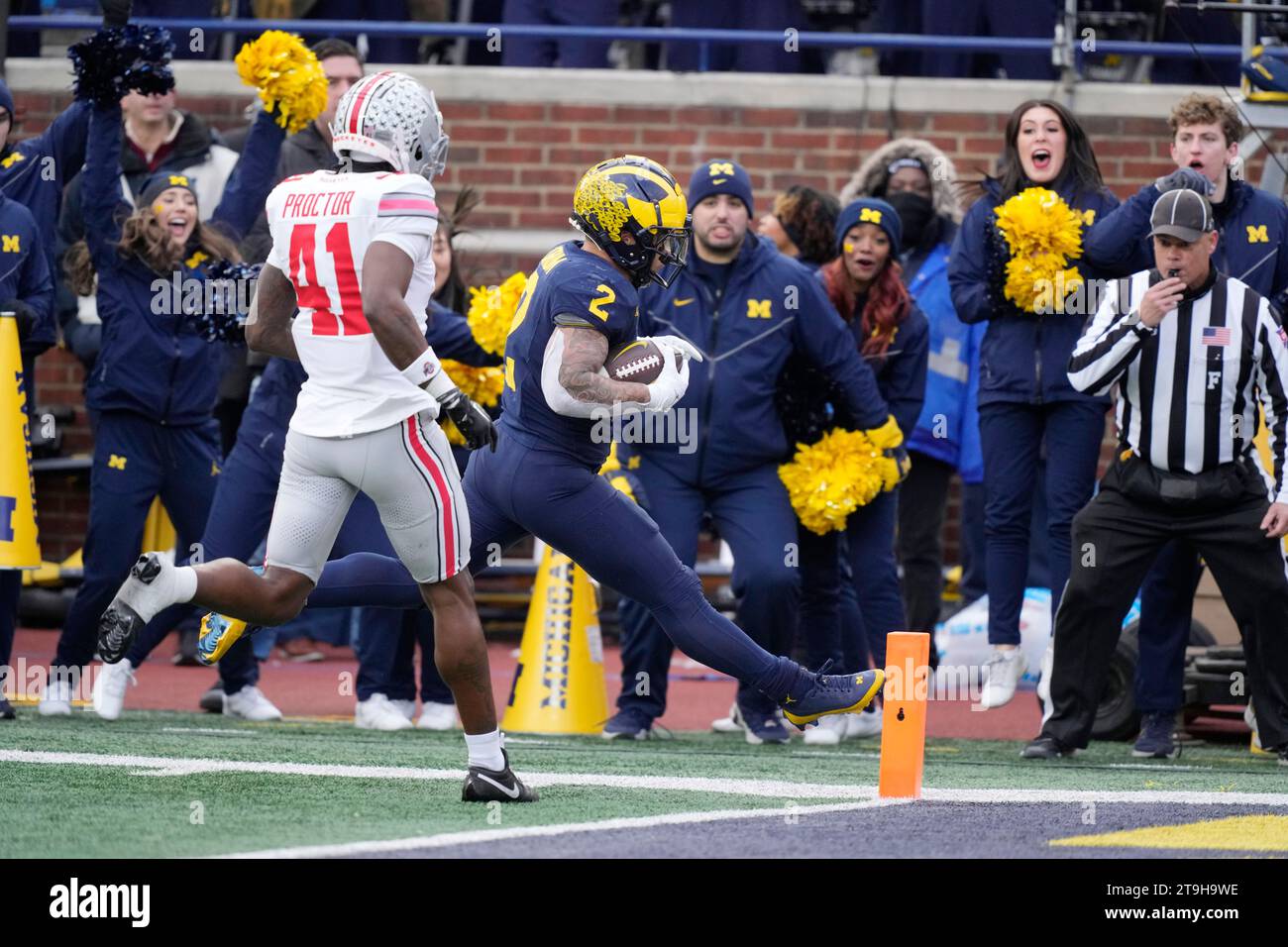 Michigan running back Blake Corum (2) outruns Ohio State safety Josh ...