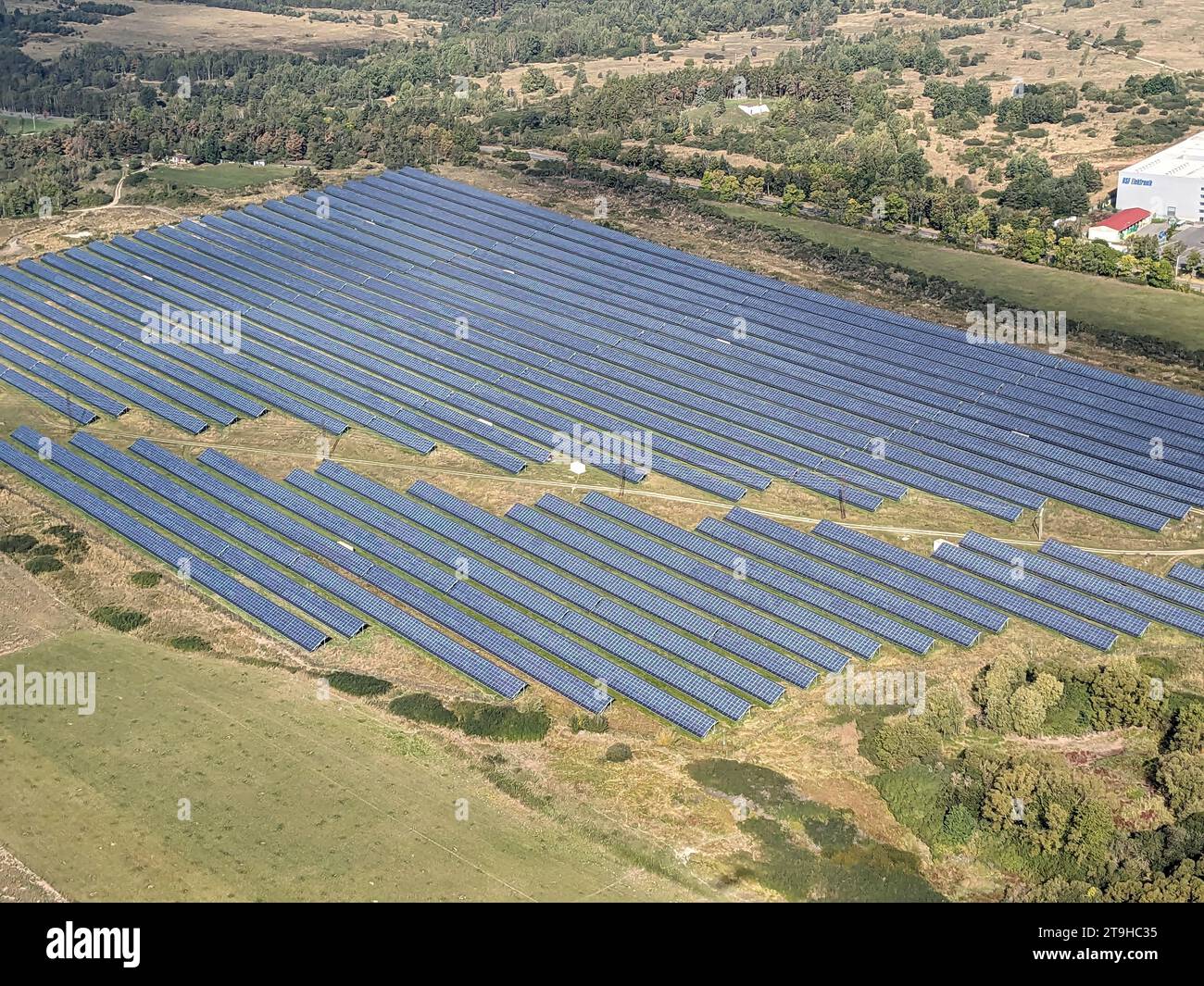 Aerial photo of solar power plant. Many solar energy panels in ...