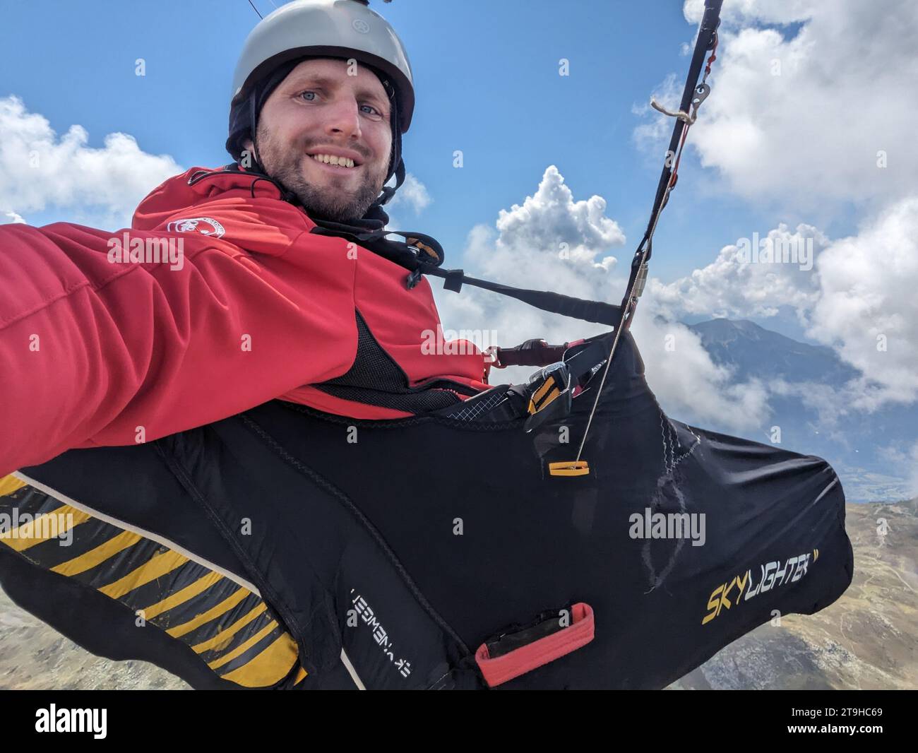 Paragliding selfie,selfie of a paragliding pilot flying high in the ...