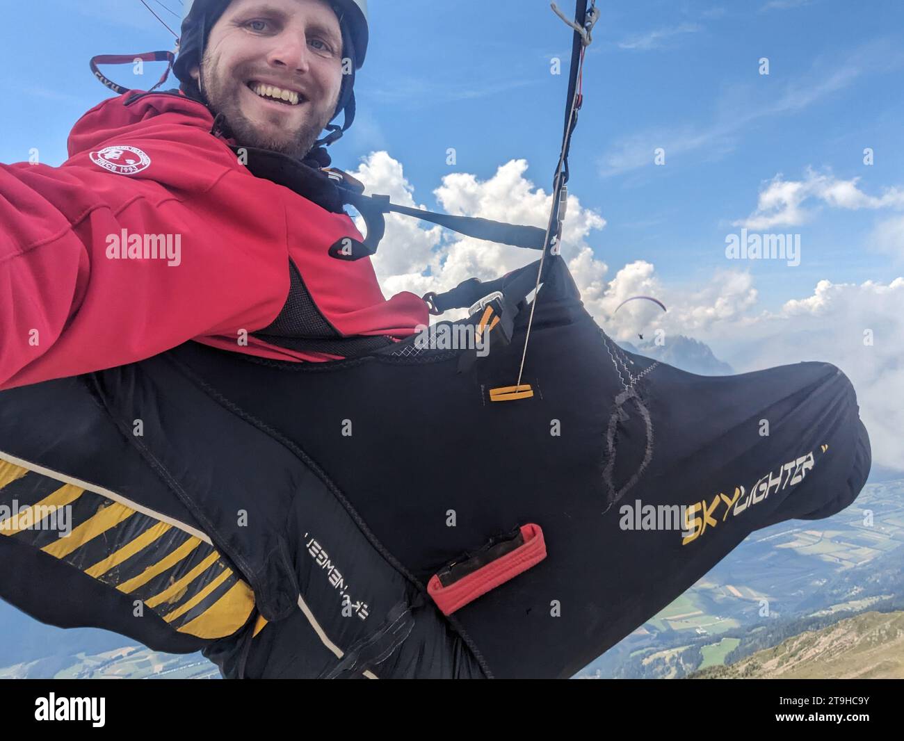 Paragliding selfie,selfie of a paragliding pilot flying high in the ...