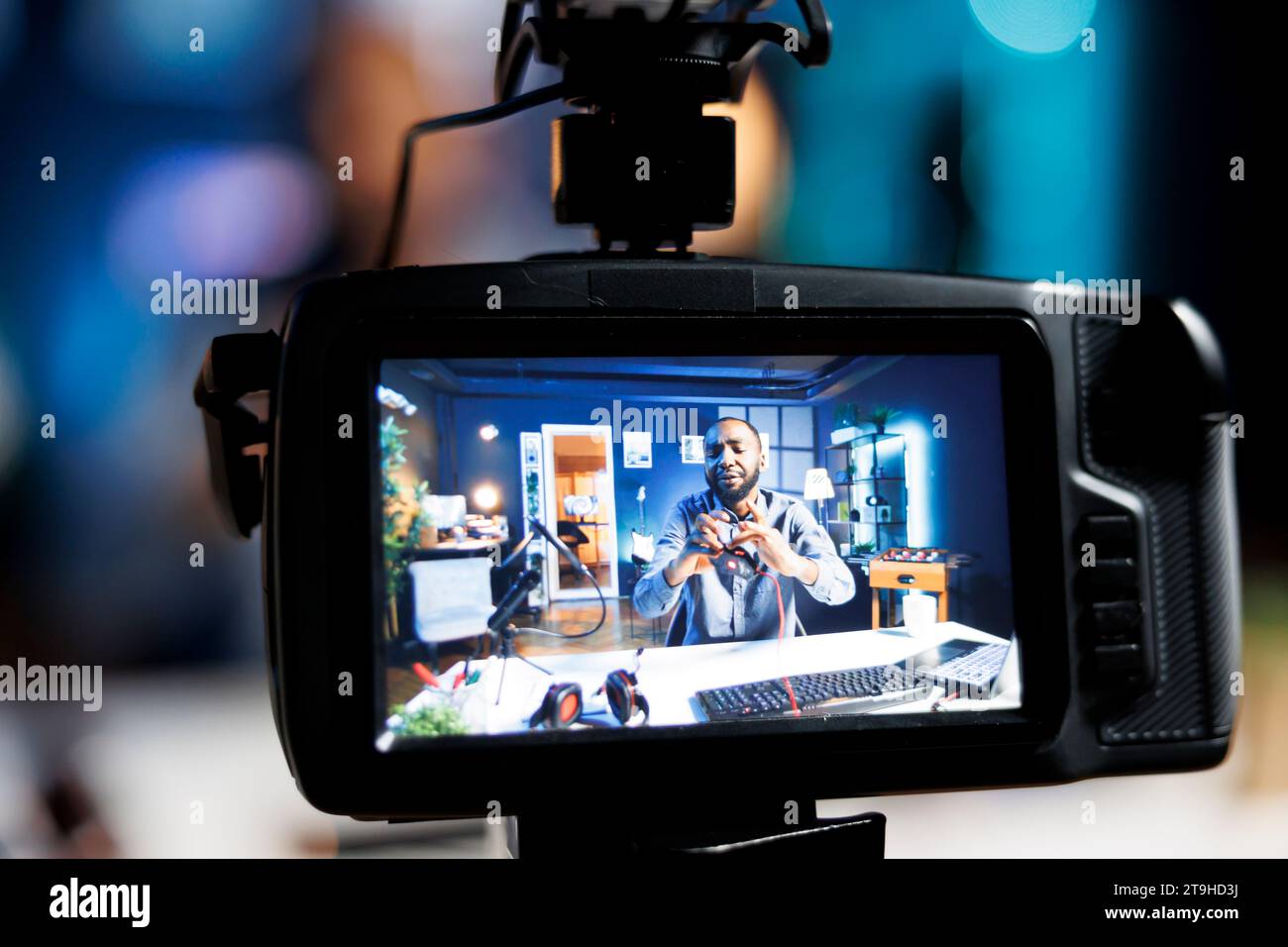 Focus on professional camera capturing footage of content creator in ...