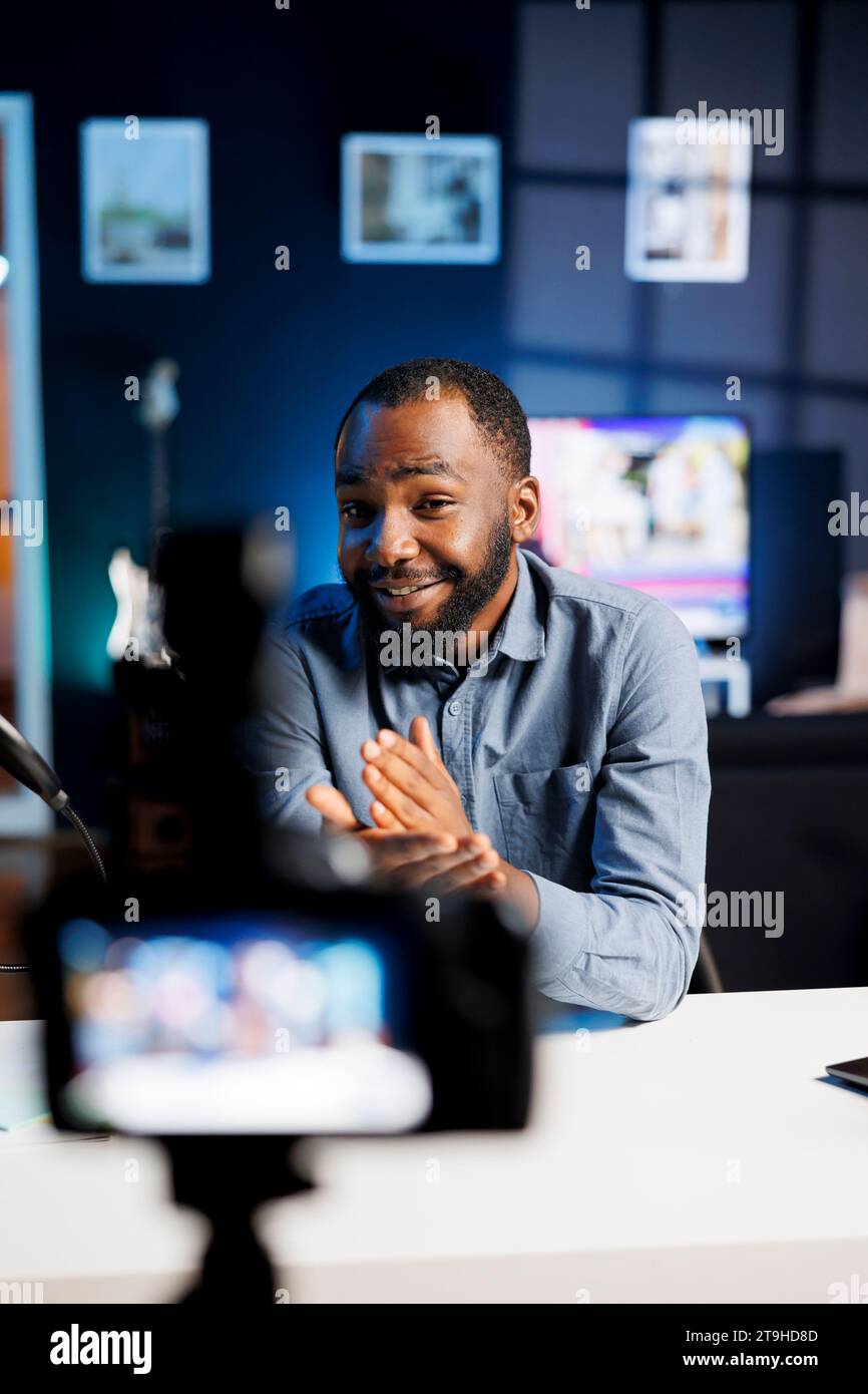 Focus on african american content creator filming tech reviews for his ...