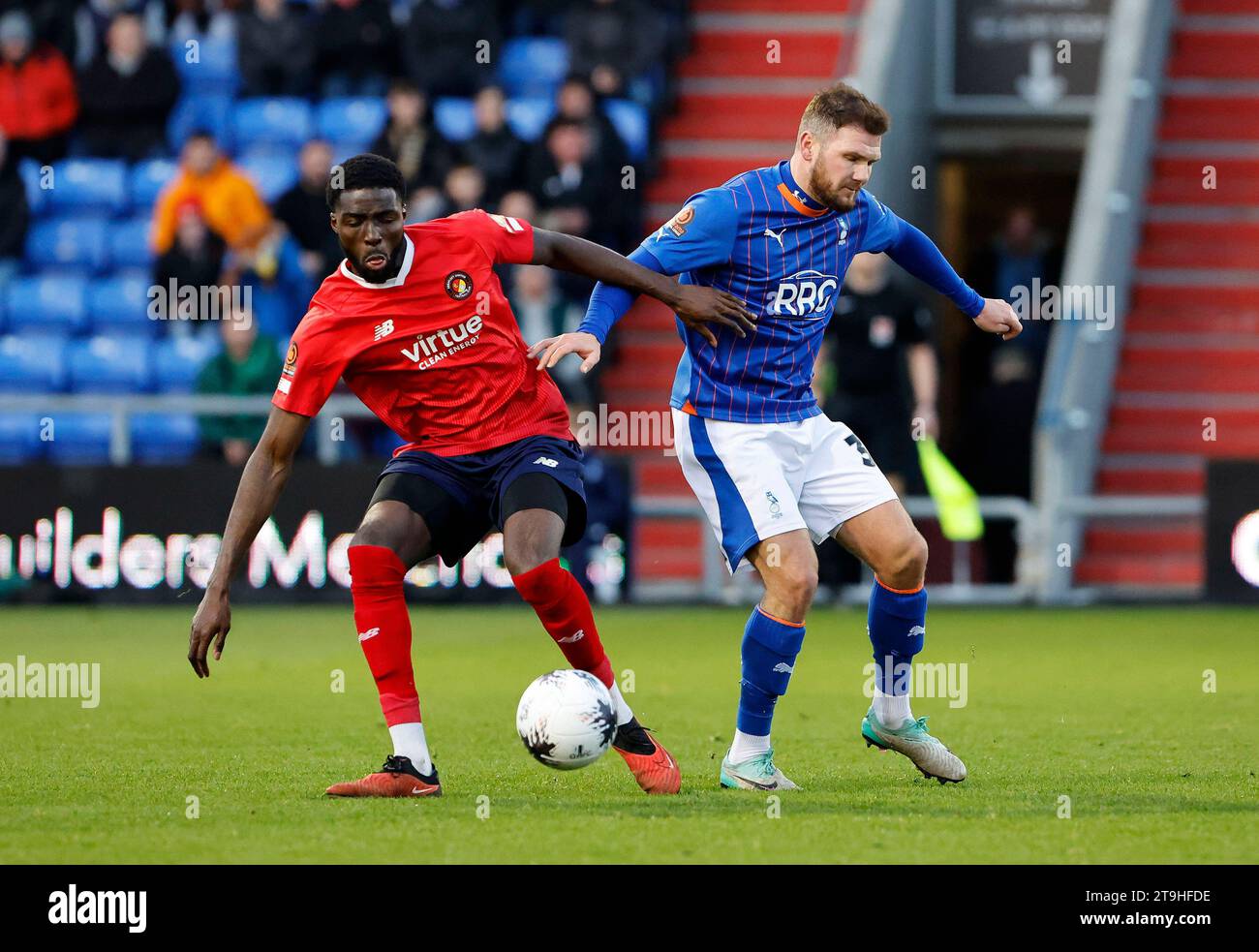 James Norwood of Oldham Athletic Association Football Club tussles with ...