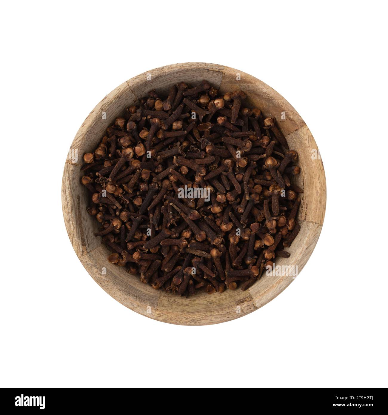 whole carnation in wooden bowl isolated on white background, dry spice ...