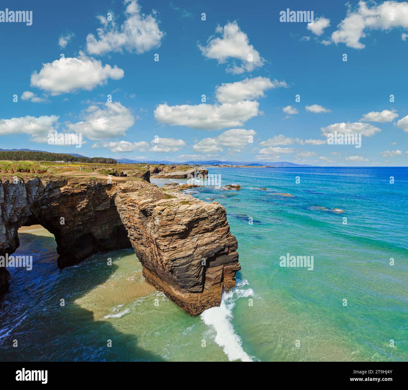 Natural rock arches on Cathedrals beach in low tide (Cantabric coast ...
