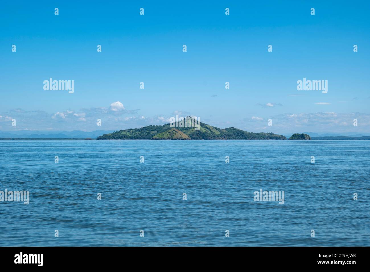 Island Seen From Afar with Volcanic Hills with Patches of Deforestation ...
