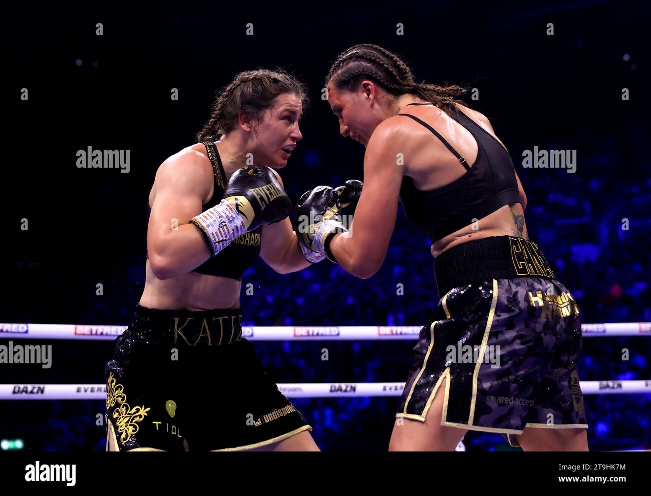 Katie Taylor (left) and Chantelle Cameron in action during their ...