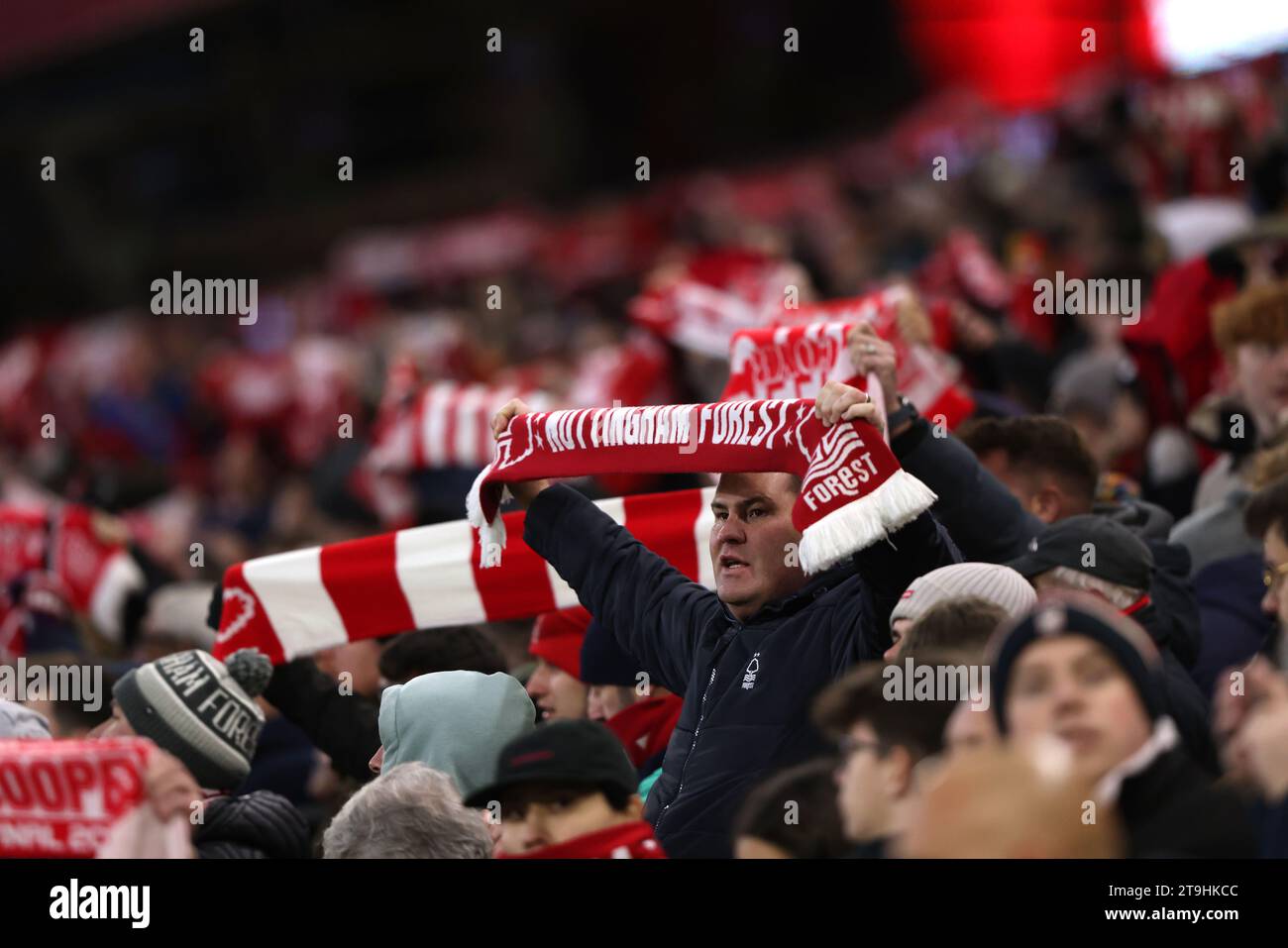 Nottingham, UK. 25th Nov, 2023. A Forest fan holds up his scarf at the ...