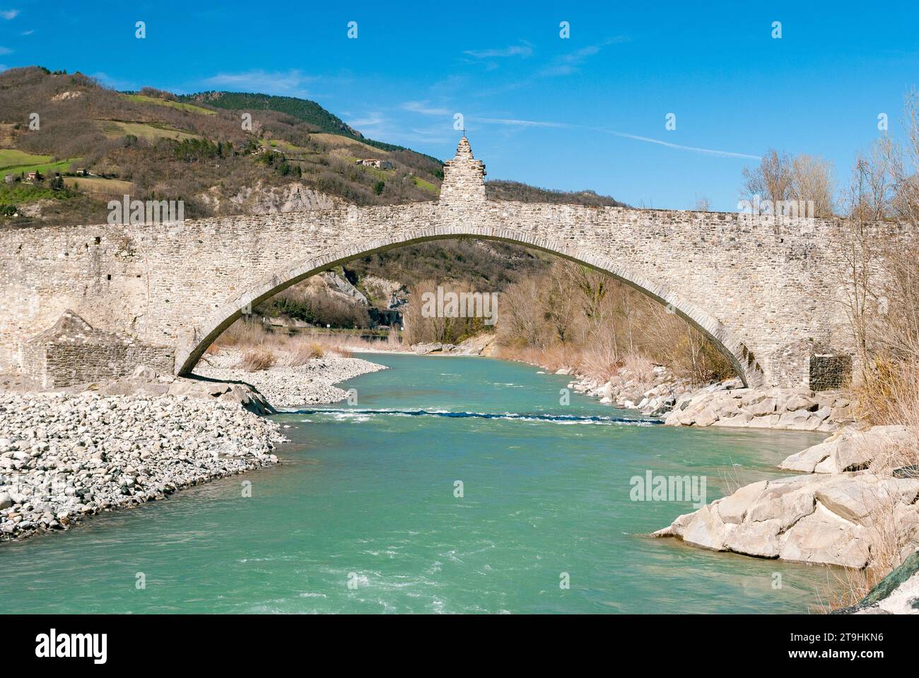 The old medieval bridge called Ponte Gobbo over the river Trebbia in ...