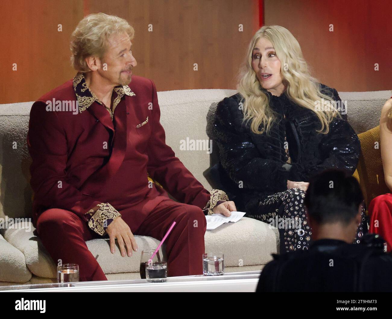 Offenburg, Germany. 26th Nov, 2023. Presenter Thomas Gottschalk talks to singer Cher during the ...