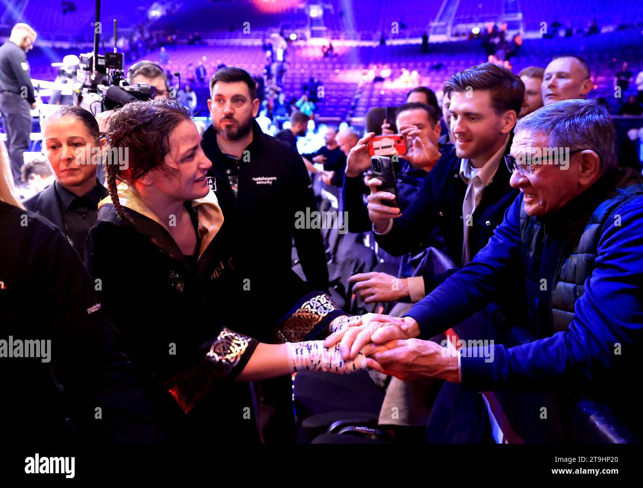 Katie Taylor interacts with a fan after winning her Undisputed Super ...