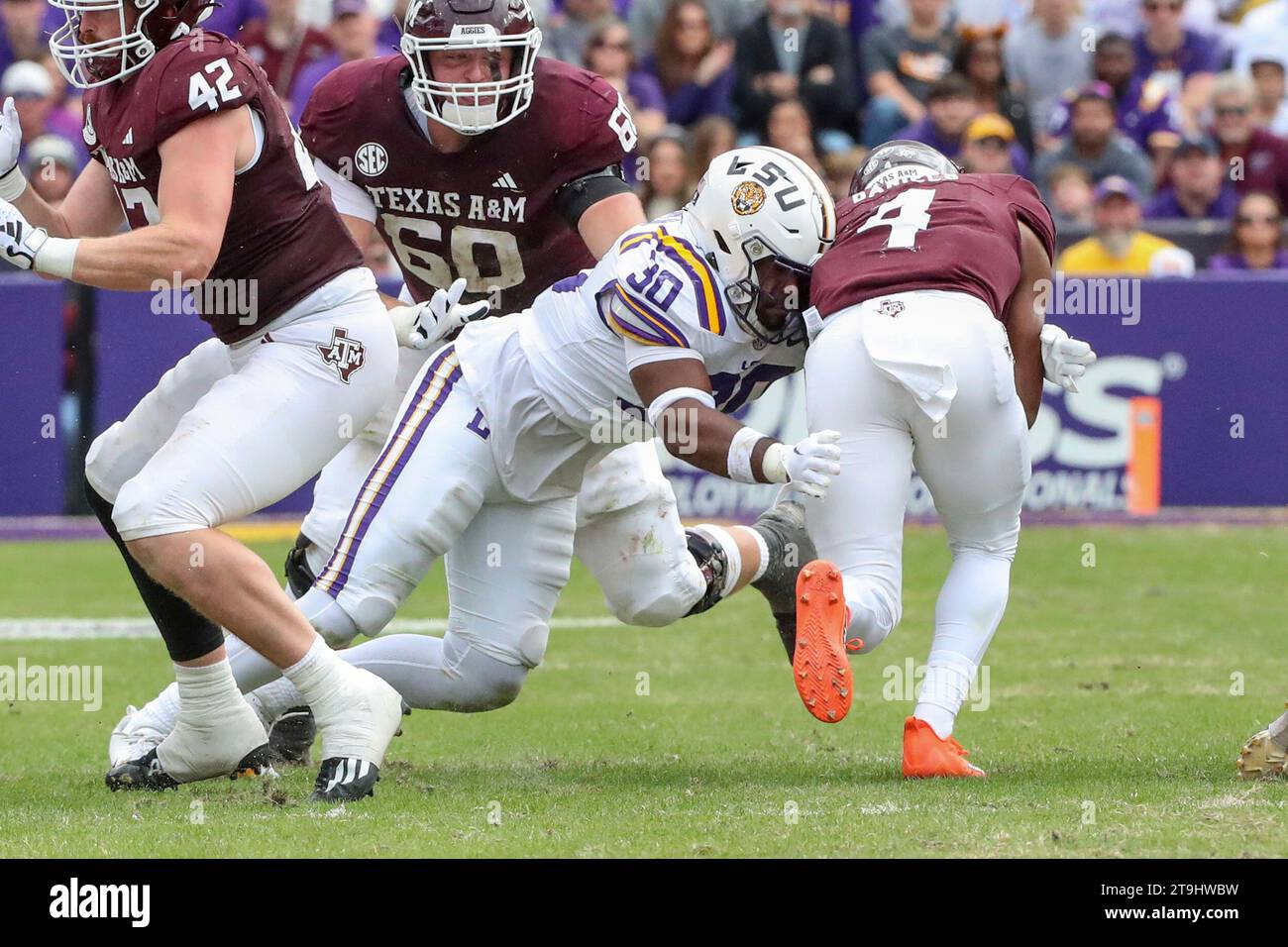 November 25, 2023: LSU linebacker Greg Penn III (30) brings down Texas ...