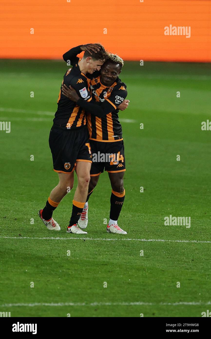 Swansea, UK. 25th Nov, 2023. Tyler Morton of Hull City (l) celebrates ...