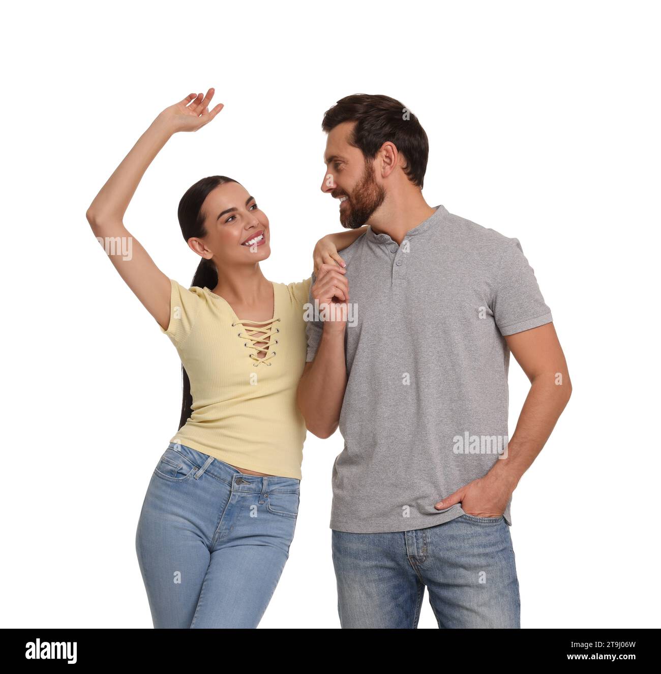 Happy couple dancing together on white background Stock Photo - Alamy