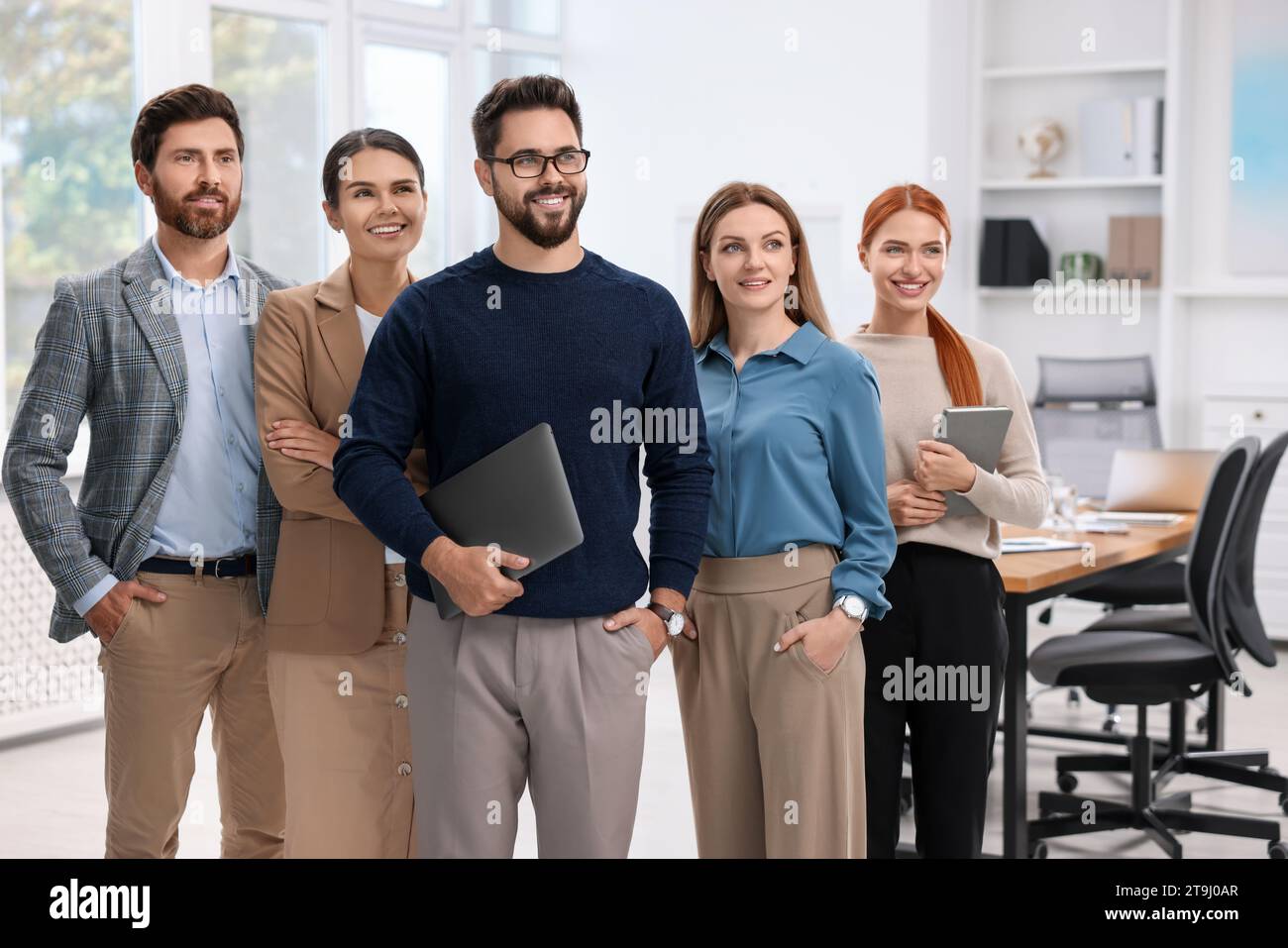 Portrait of happy employees in office. Team work Stock Photo - Alamy
