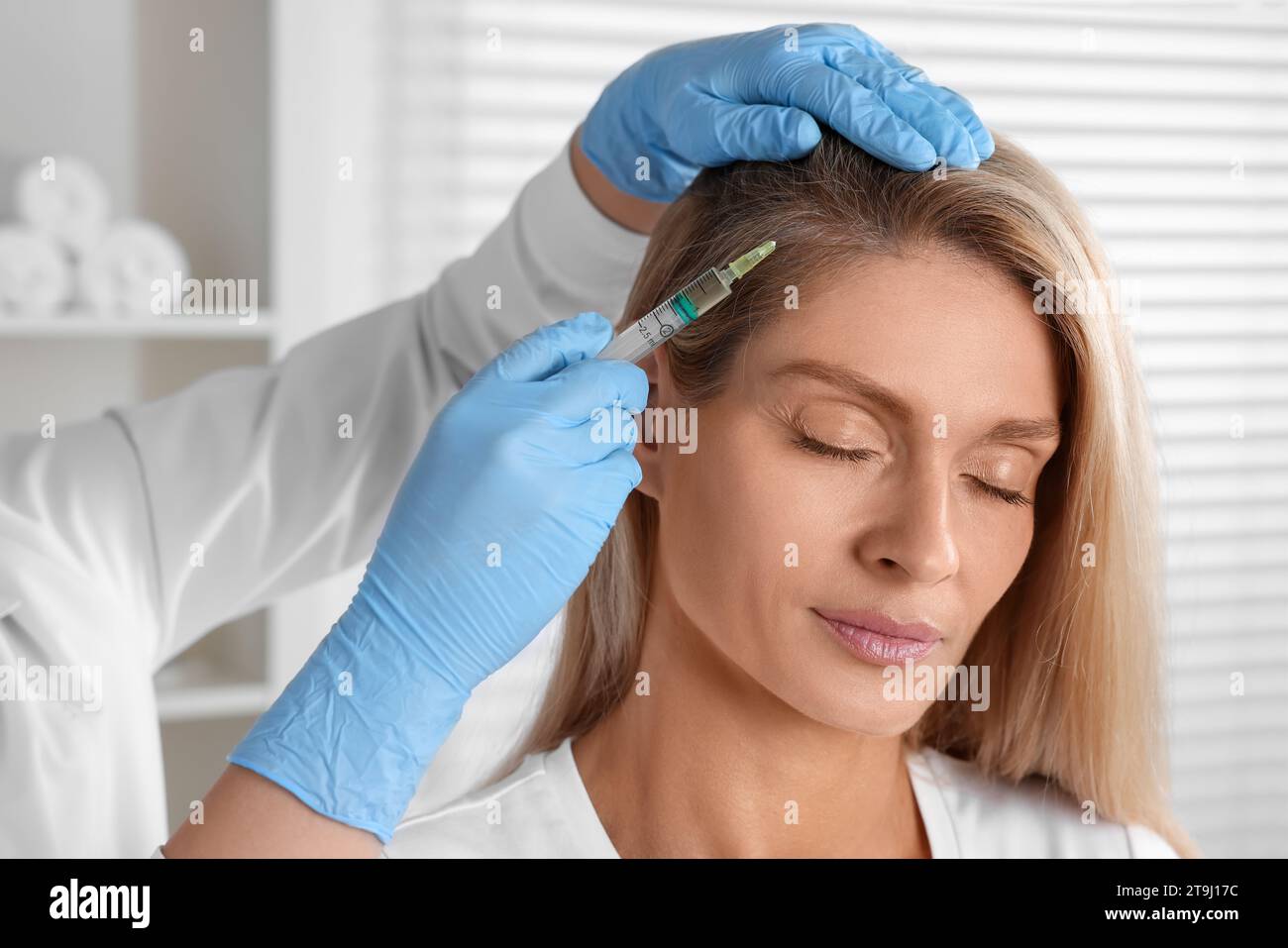 Hands in gloves giving injection hi-res stock photography and images ...