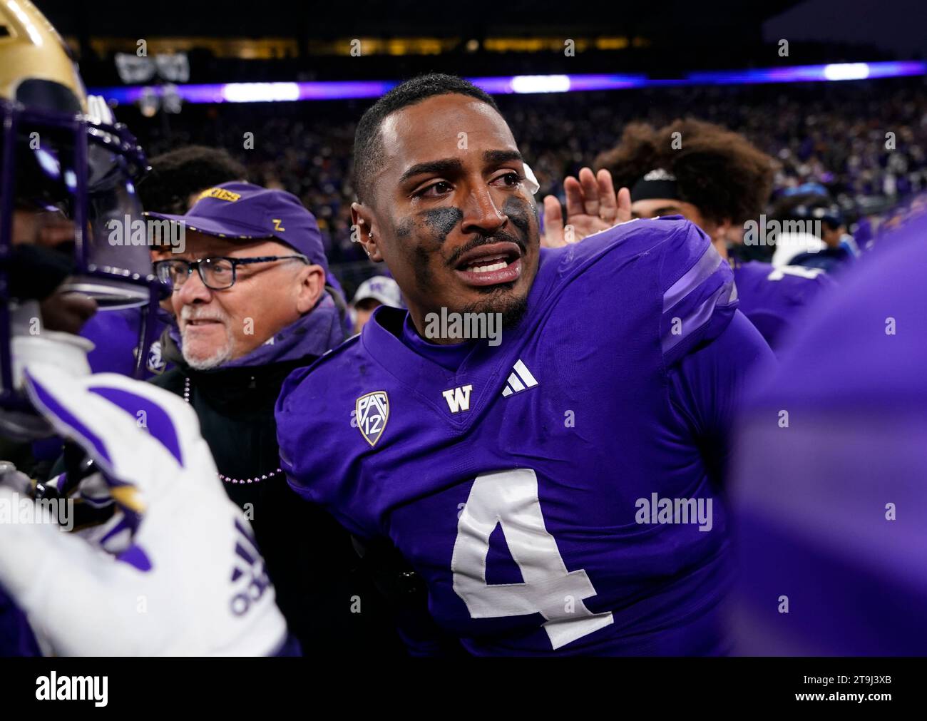 Washington defensive end Zion Tupuola-Fetui (4) cries as he celebrates ...