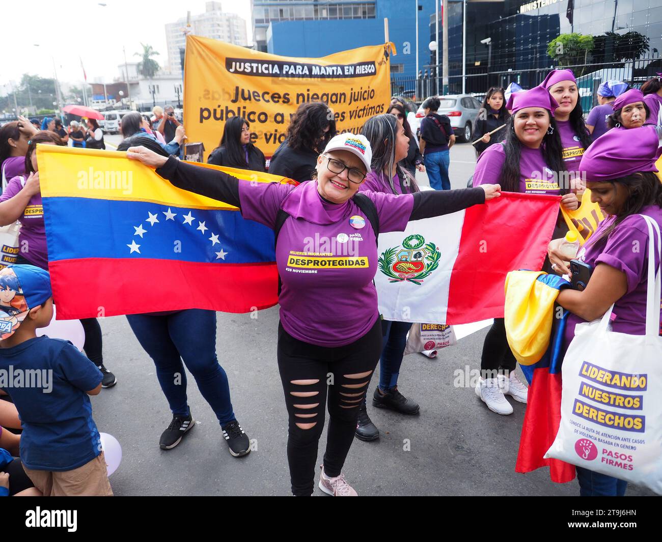 Lima, Peru. 25th Nov, 2023. Venezuelan and Peruvian flags carried by an ...