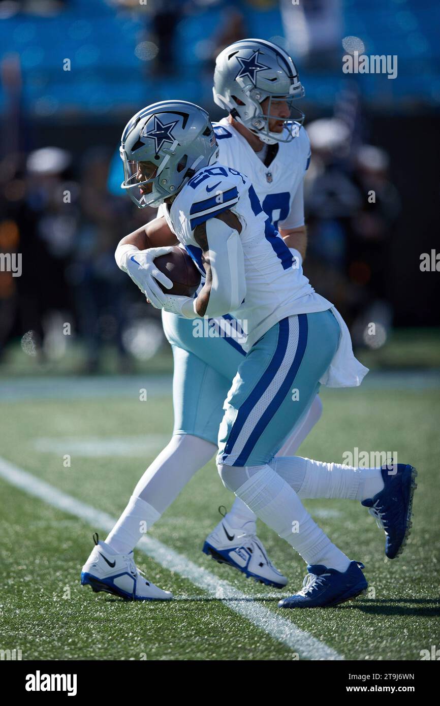 Dallas Cowboys running back Tony Pollard (20) takes a hand-off from ...