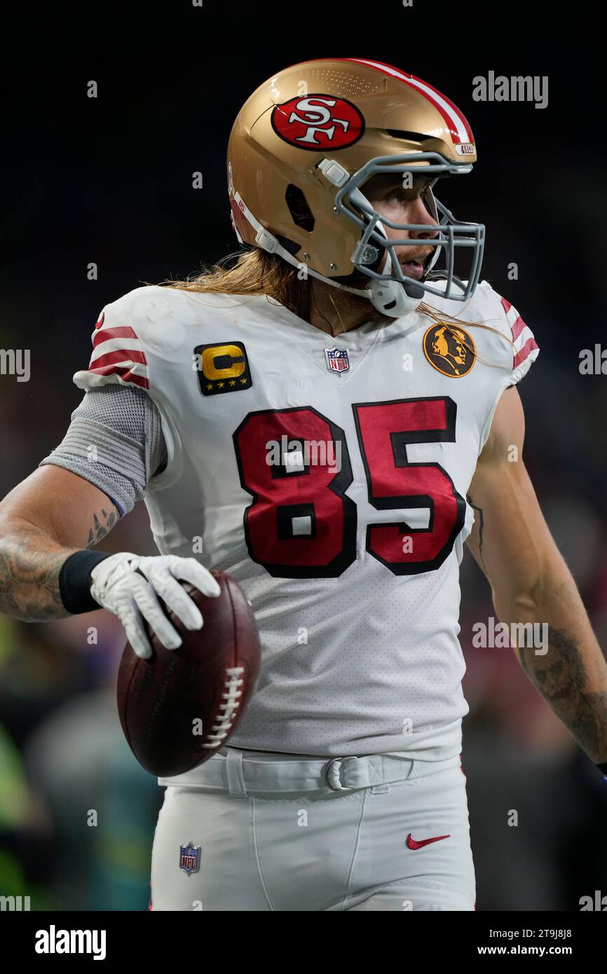 San Francisco 49ers tight end George Kittle (85) looks on with the ball ...