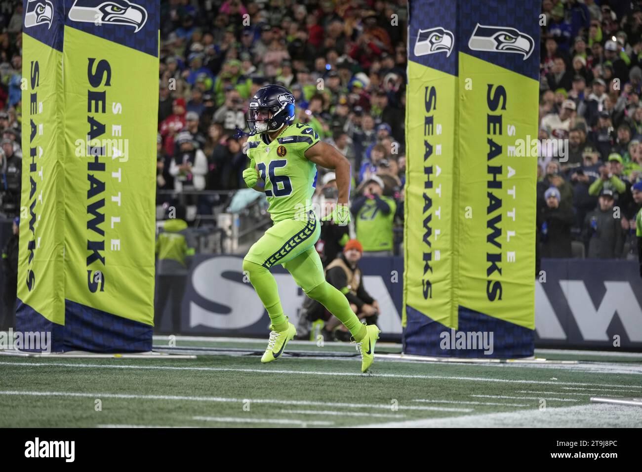 Seattle Seahawks running back Zach Charbonnet (26) runs out on to the ...