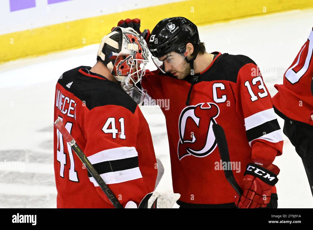 New Jersey Devils center Nico Hischier (13) celebrates with goaltender ...