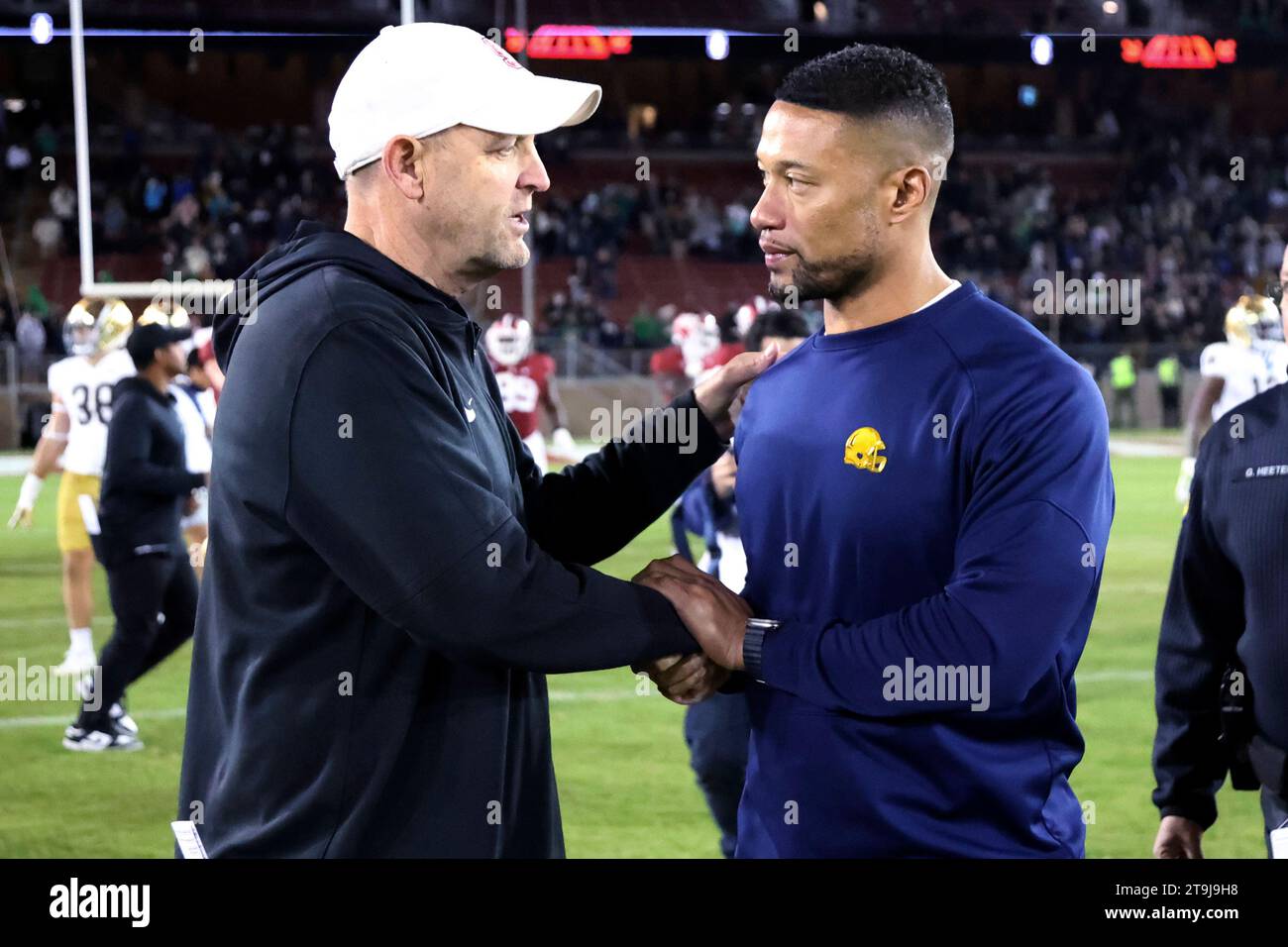 Notre Dame coach Marcus Freeman, right, and Stanford coach Troy Taylor ...