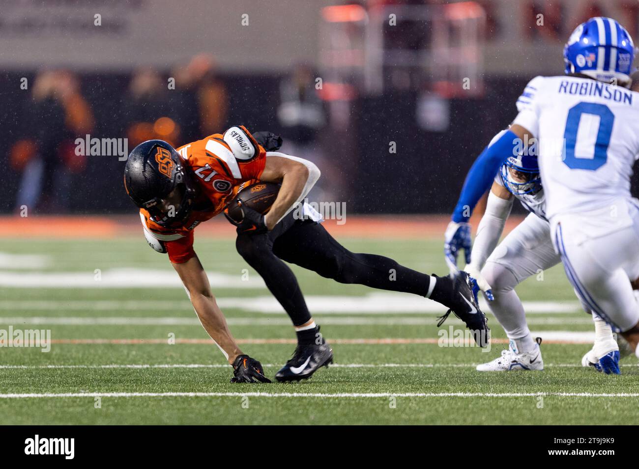 Oklahoma State wide receiver Leon Johnson III (17) catches the ball ...