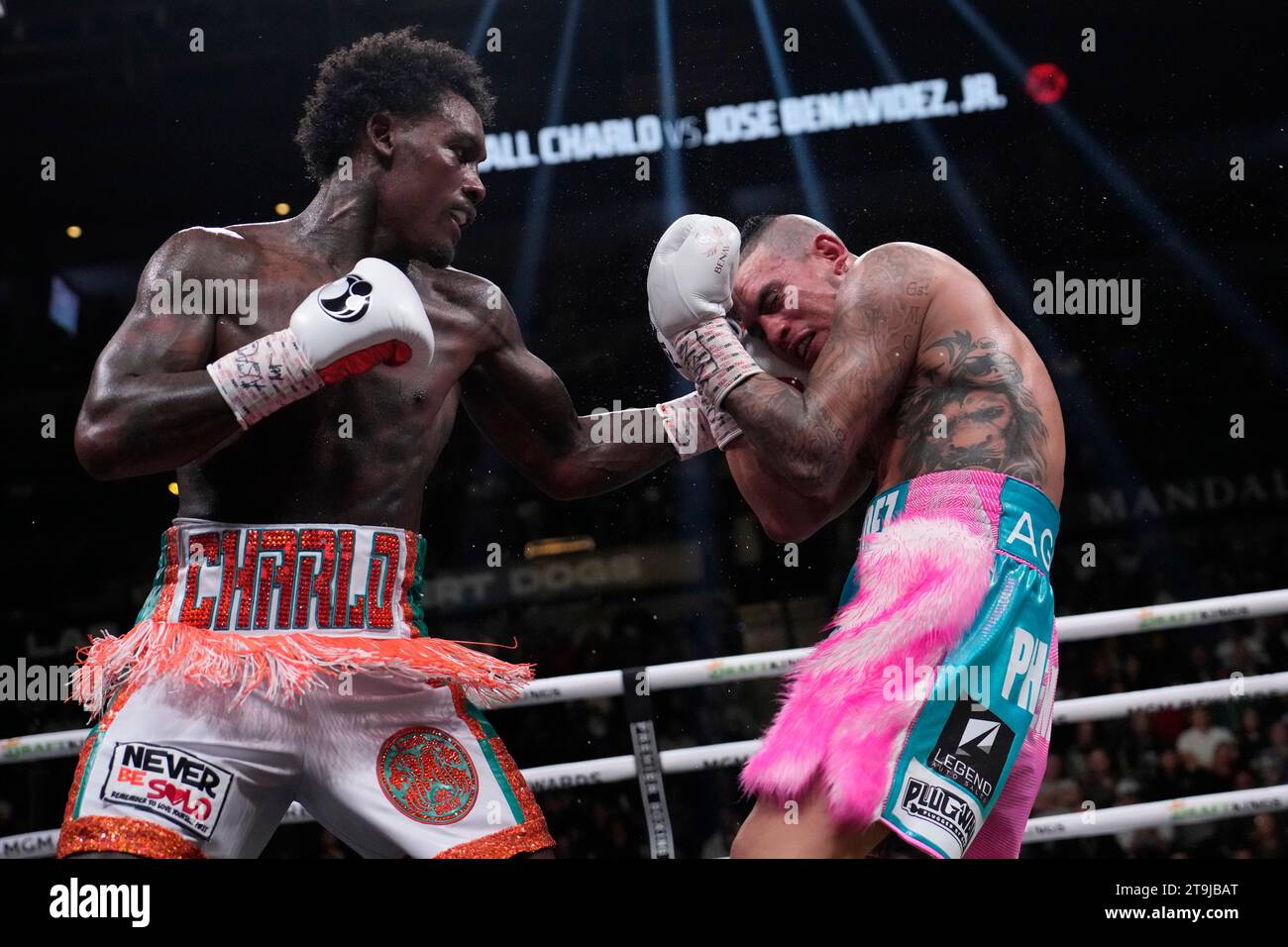 Jermall Charlo, left, hits Jose Benavidez Jr., right, during a ...