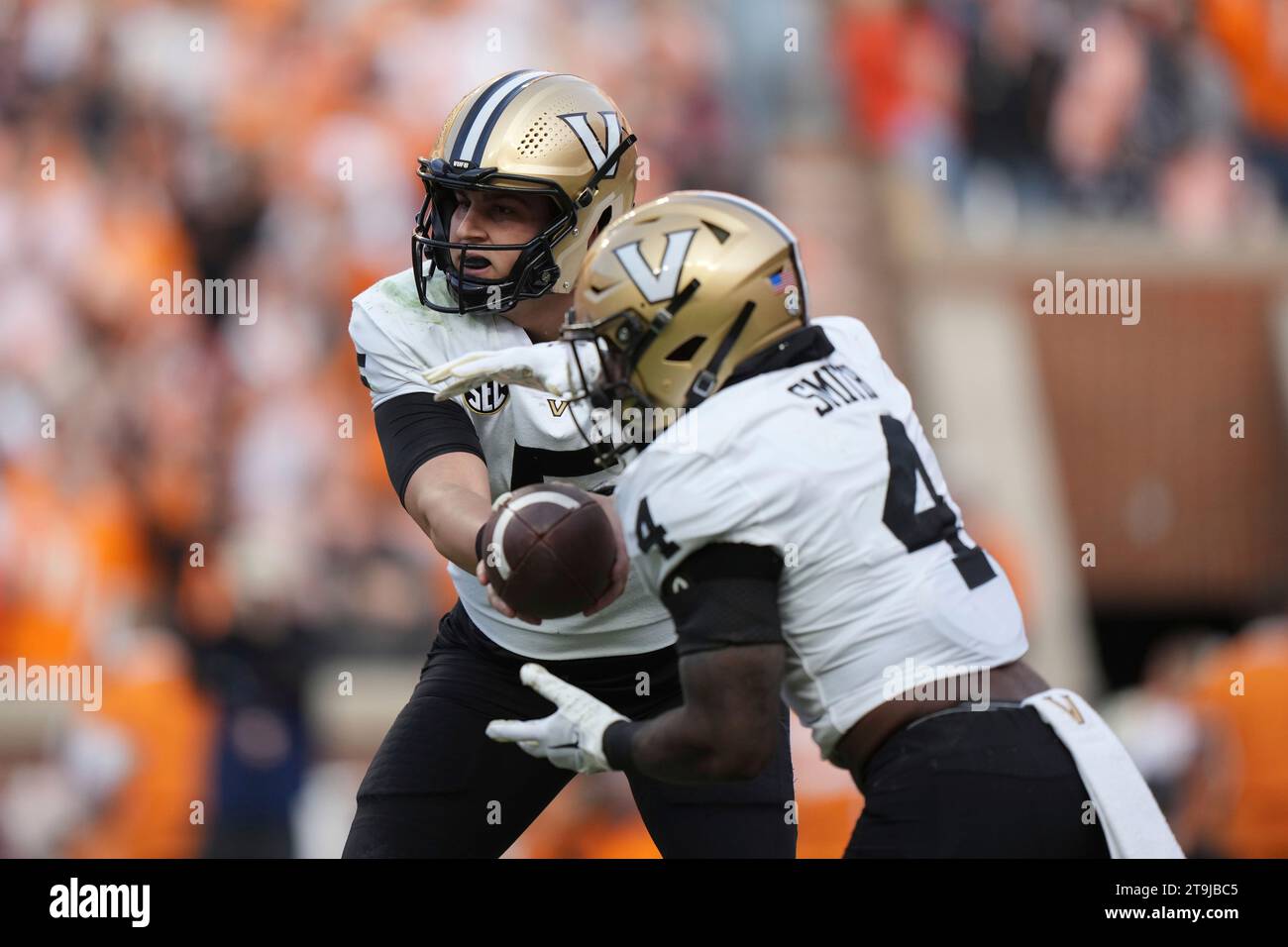 November 25, 2023: AJ Swann #5 hands the ball Patrick Smith #4 of the ...
