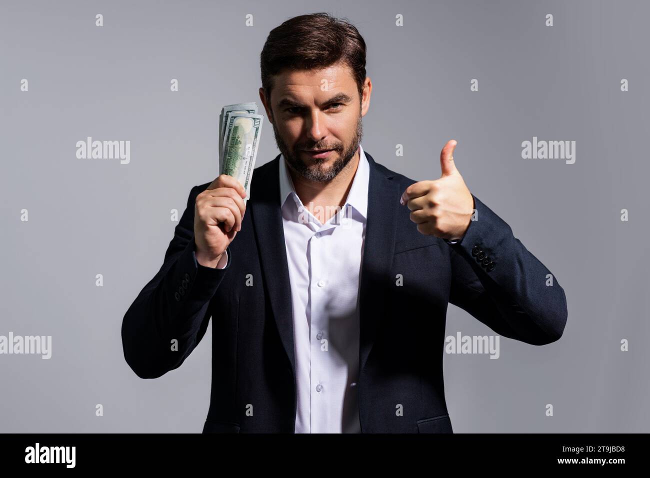 Man showing cash money in dollar banknotes. Portrait of business man ...
