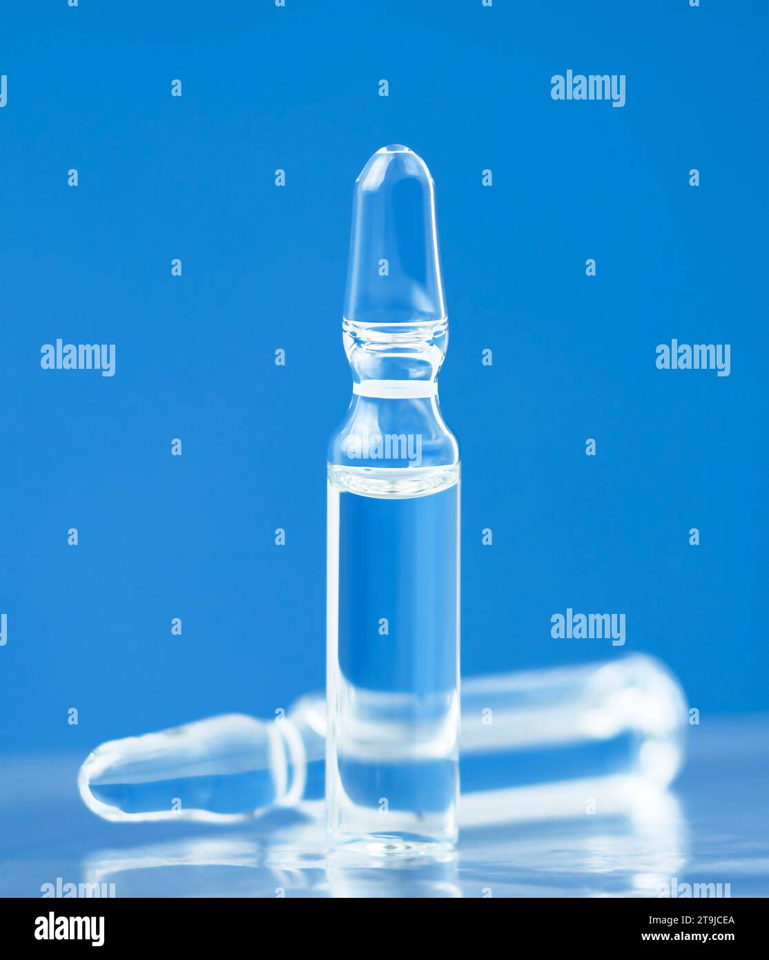 Medical ampoules for injection on a blue background Stock Photo - Alamy