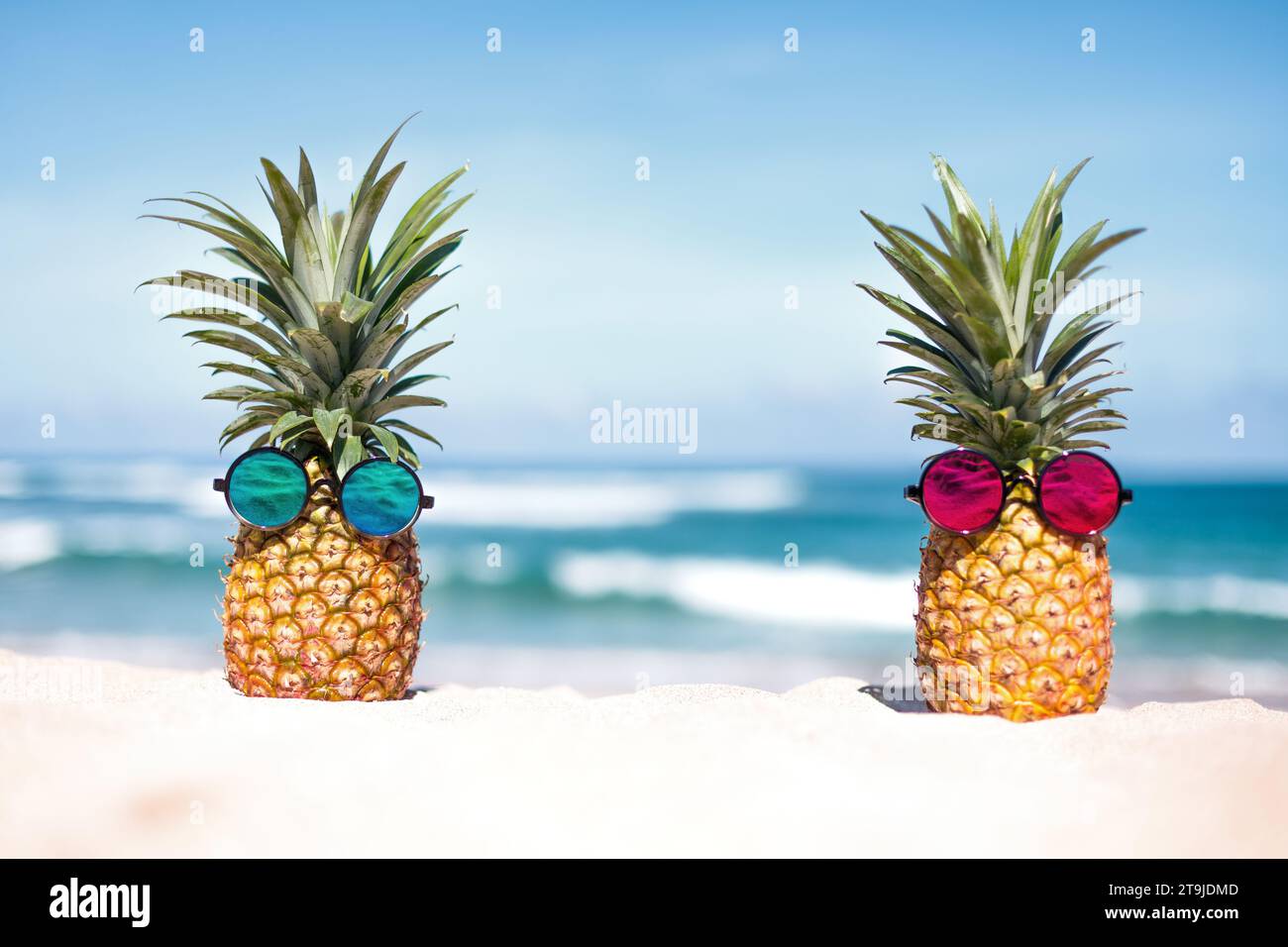 Two pineapples on beach tourism hi-res stock photography and images - Alamy