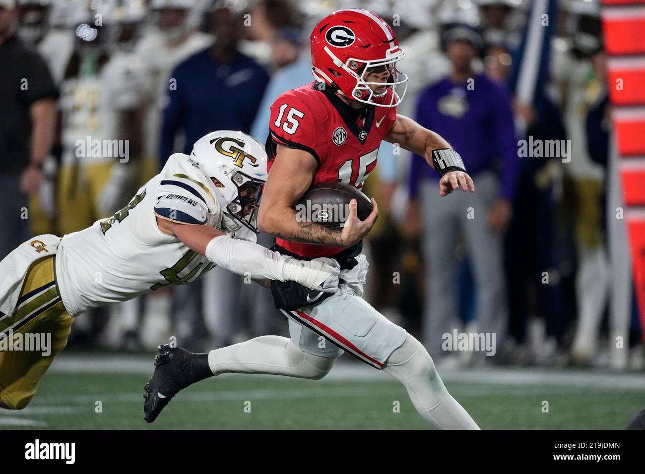 Georgia quarterback Carson Beck (15) is tackled by Georgia Tech ...