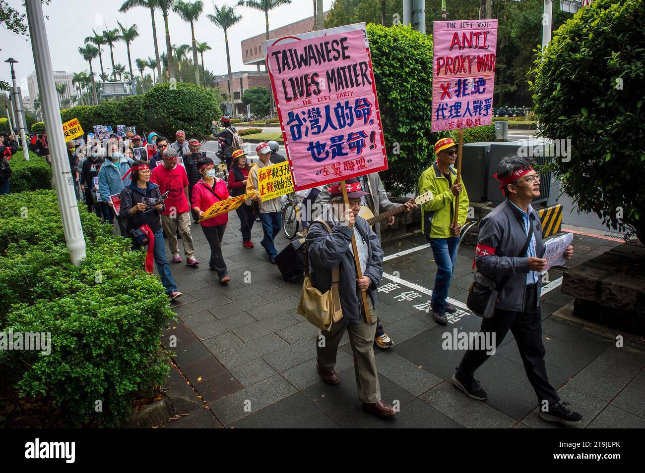 Demonstrators march along Zhongshan South Road near Liberty Square ...