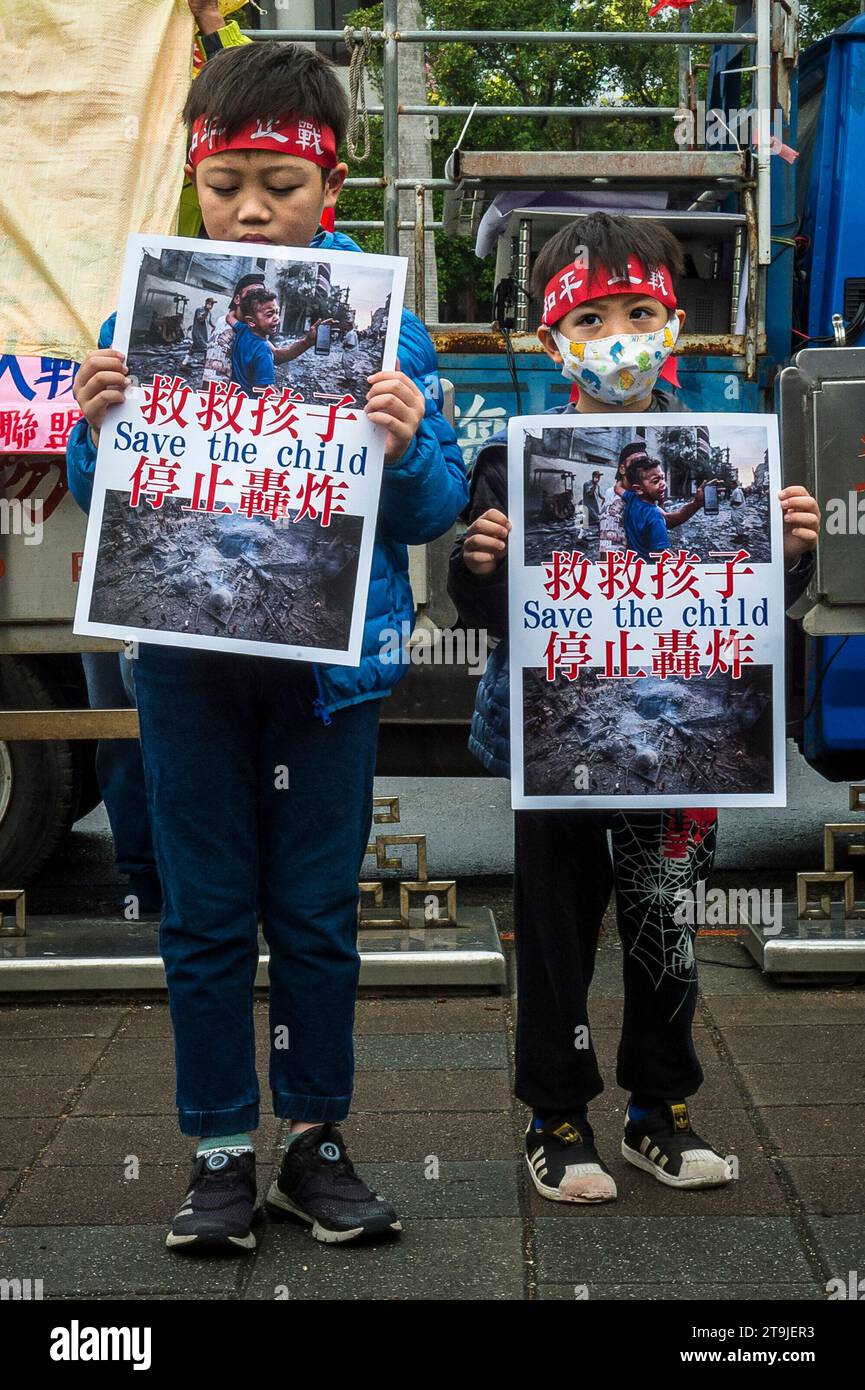 Demonstrators march along Zhongshan South Road near Liberty Square ...