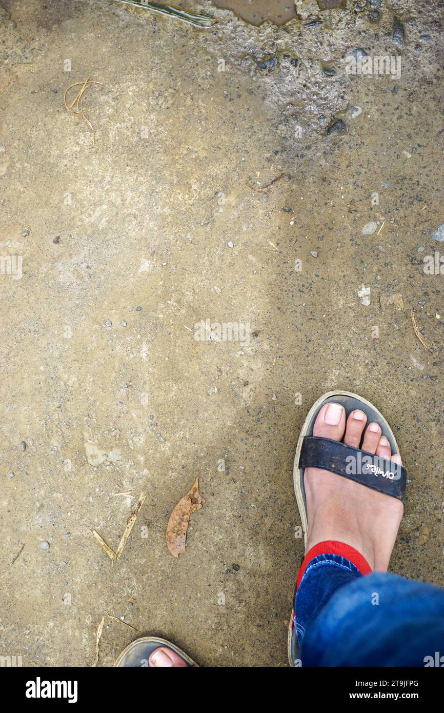 Stock photo of sandals and shoes being worn Stock Photo - Alamy