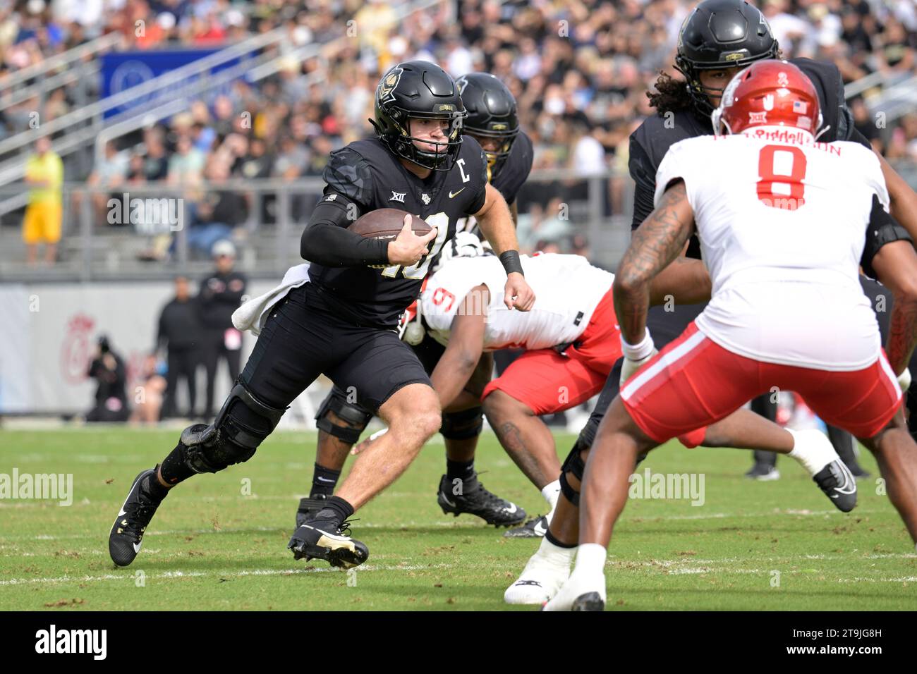 Central Florida quarterback John Rhys Plumlee (10) scrambles for ...