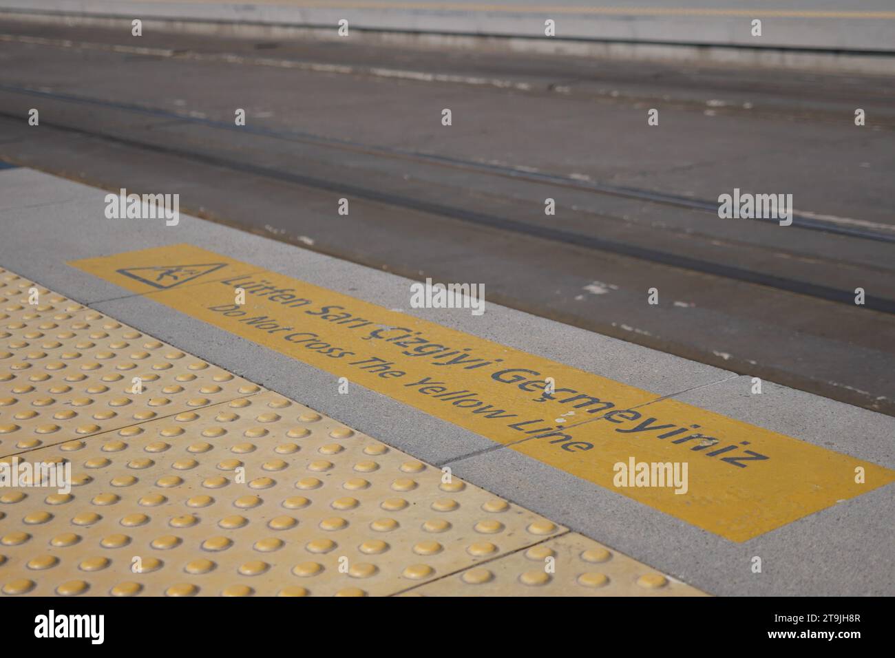 the caution sign at metro station Stock Photo - Alamy