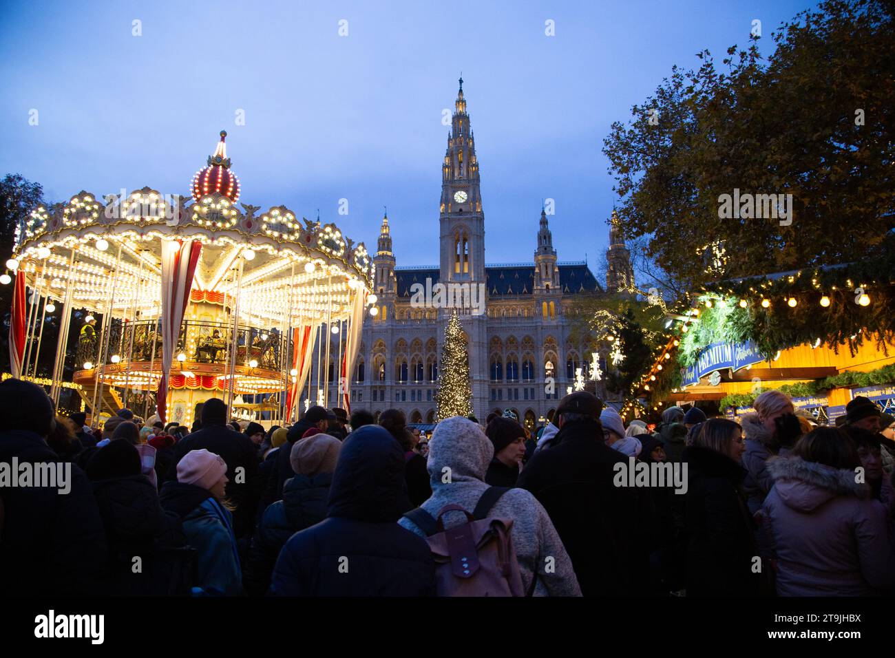 A merry-go-round decorated with beautiful lights in the middle of a ...