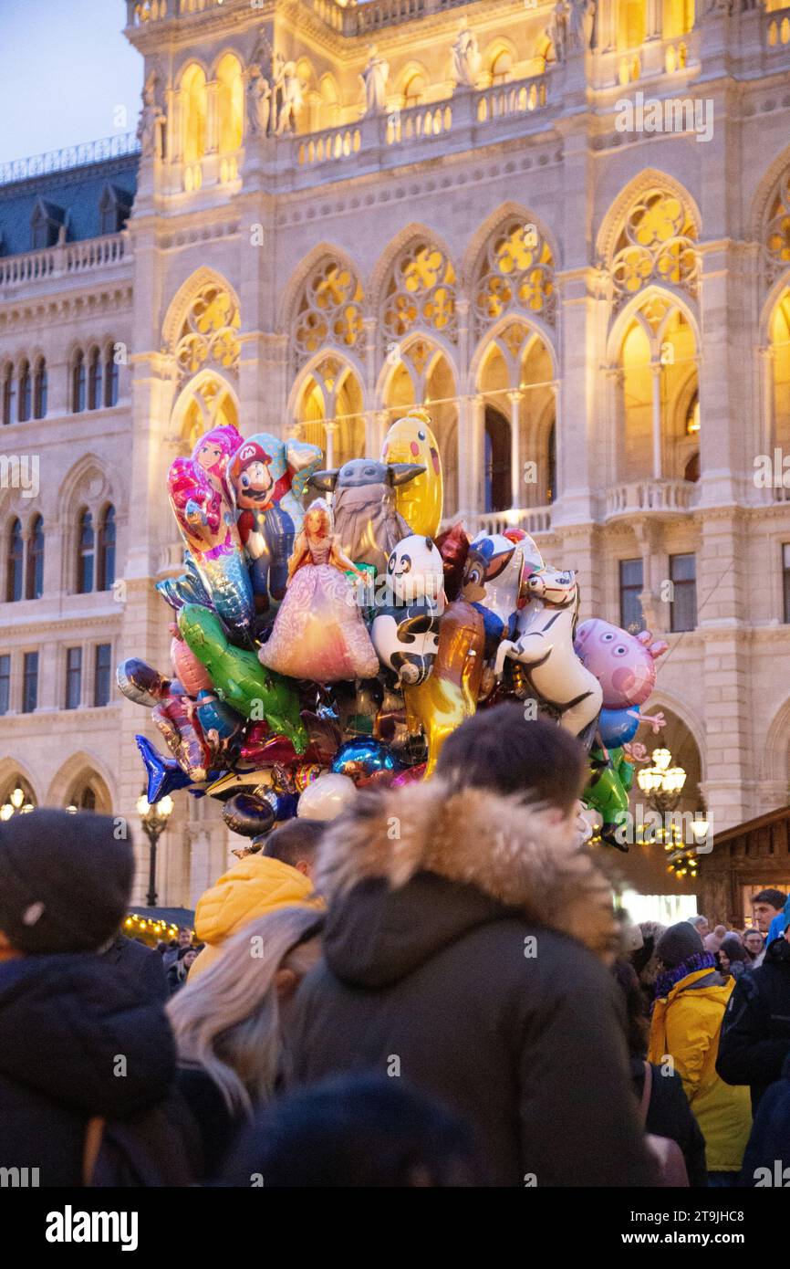 Seller of balloons for children in the crowd of Christmas Market ...