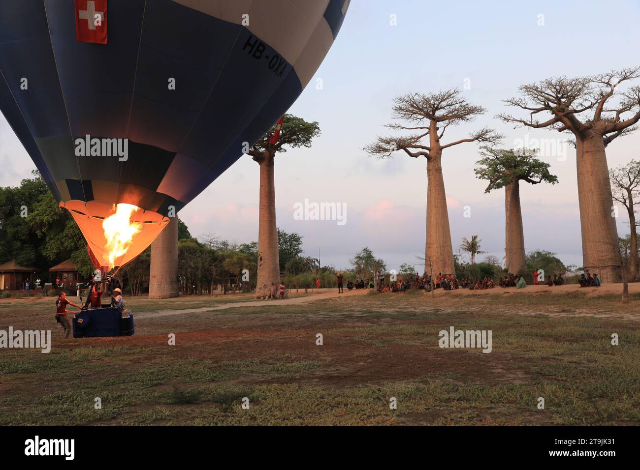 Morondava, Madagascar. 25th Nov, 2023. People prepare to fly a hot air ...