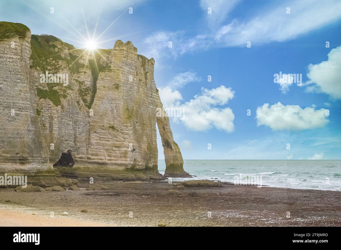Etretat in Normandy, the famous cliffs and needle on the pebble beach ...