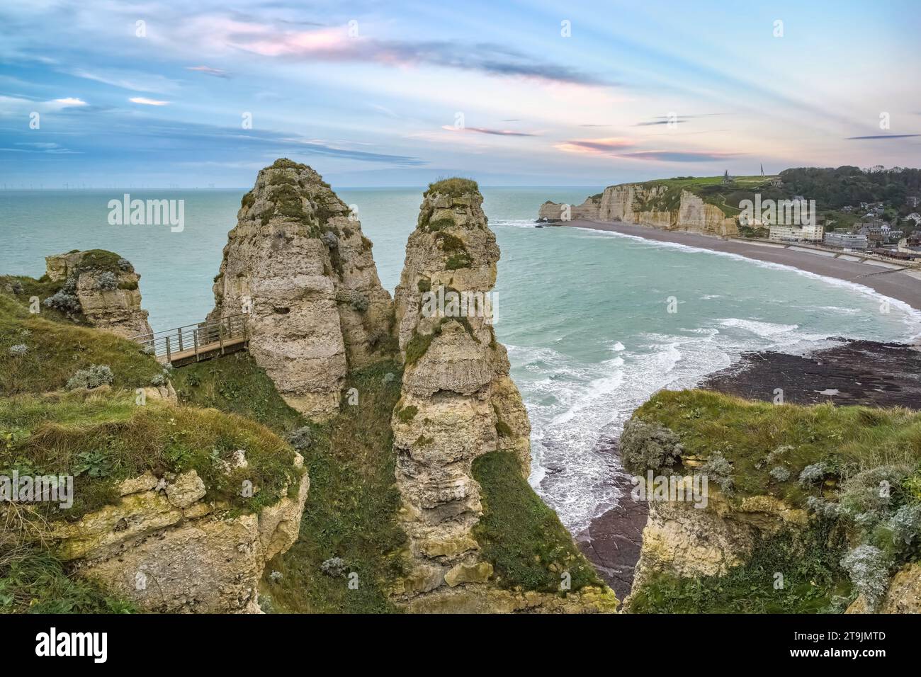 Etretat in Normandy, the famous cliffs and needle on the pebble beach ...