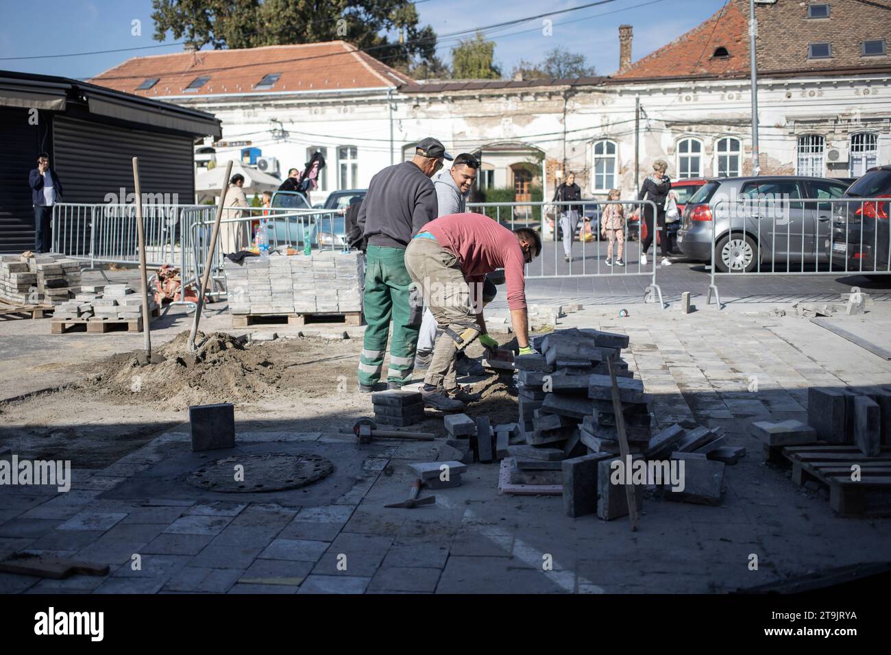 Belgrade, Serbia, Oct 18, 2023: Construction workers paving the plateau ...