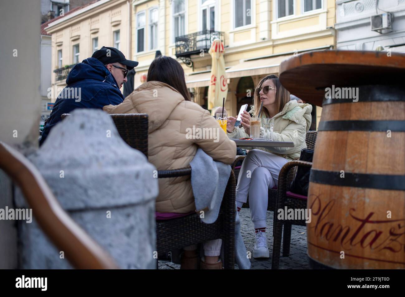 Belgrade, Serbia, Nov 19, 2023: A small group of friends spend time in ...