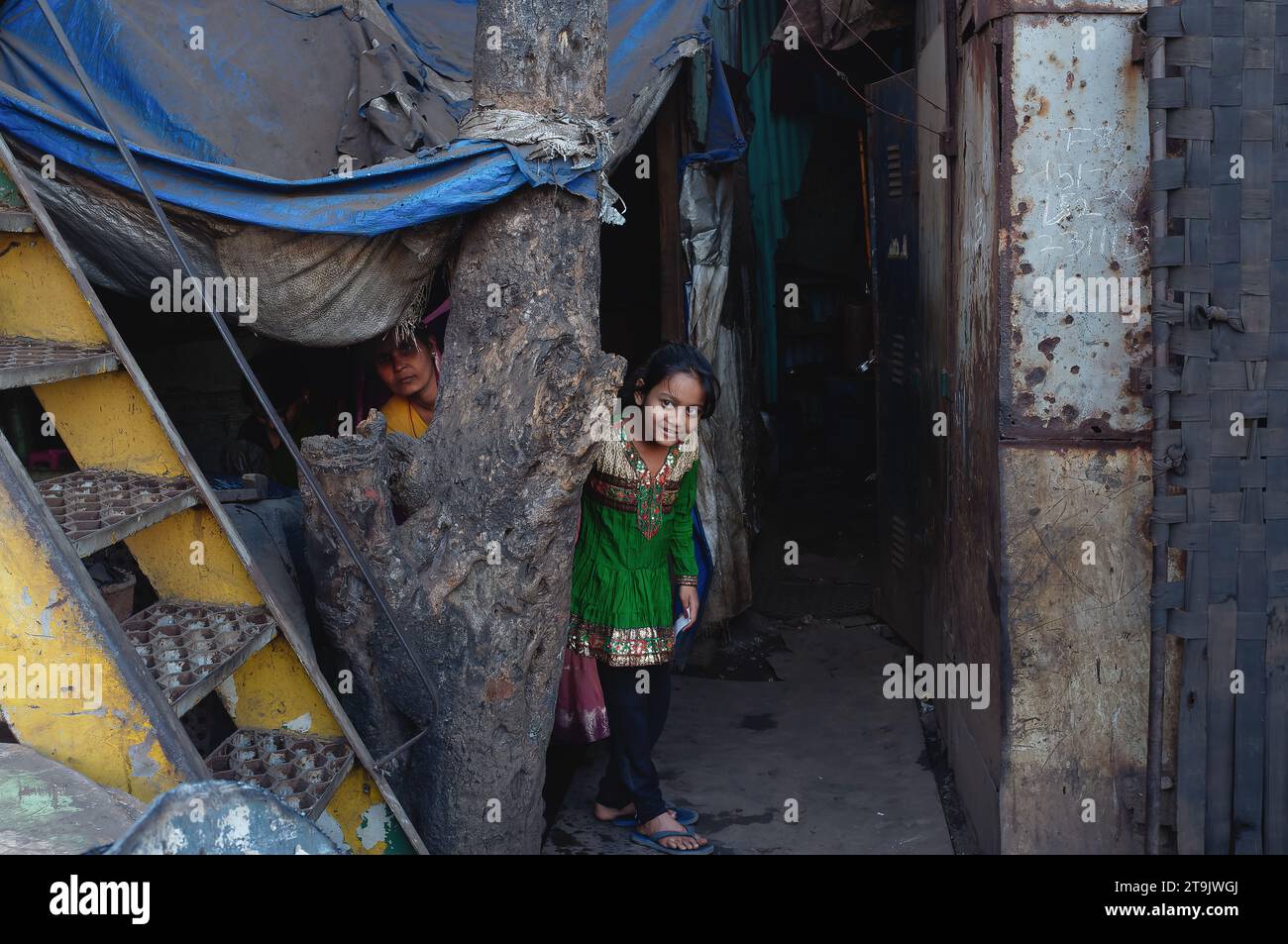 A young Indian girl in Darukhana slum area, Mazagaon, Mumbai, India ...